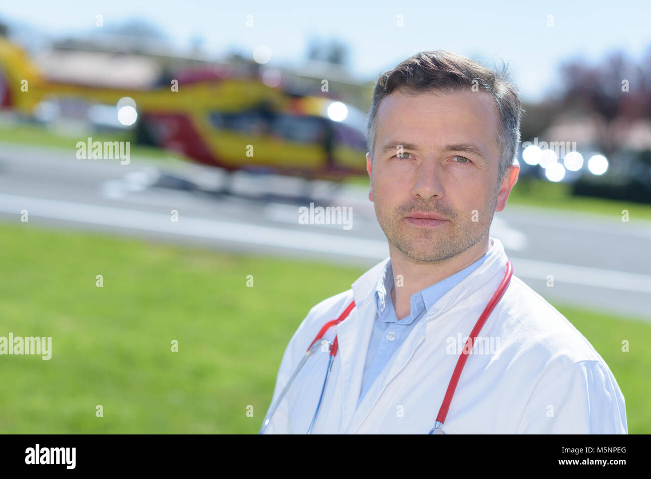 portrait of a male doctor near emergency helicopter Stock Photo - Alamy