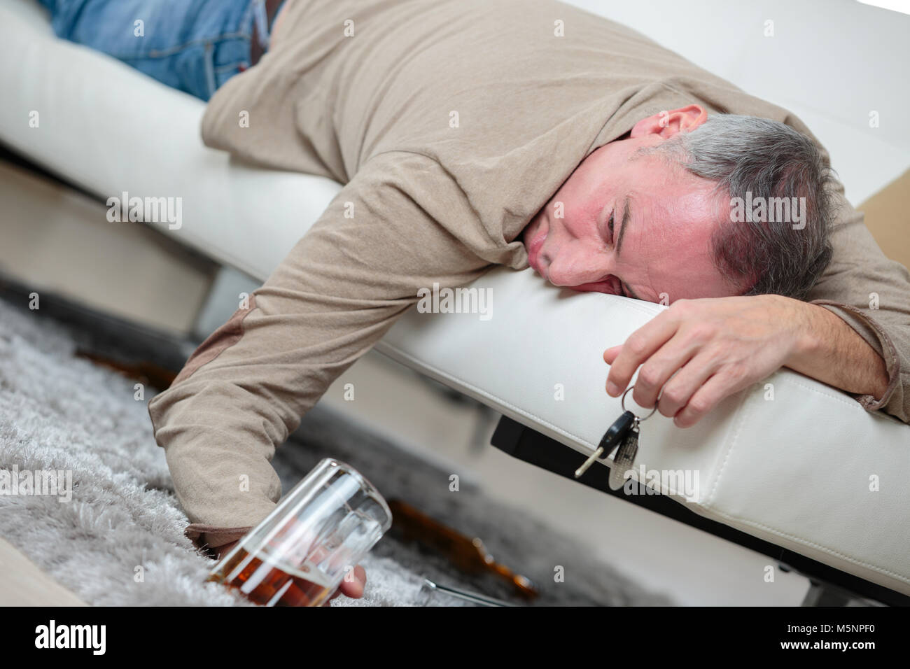 tired drunk man after party at home Stock Photo - Alamy