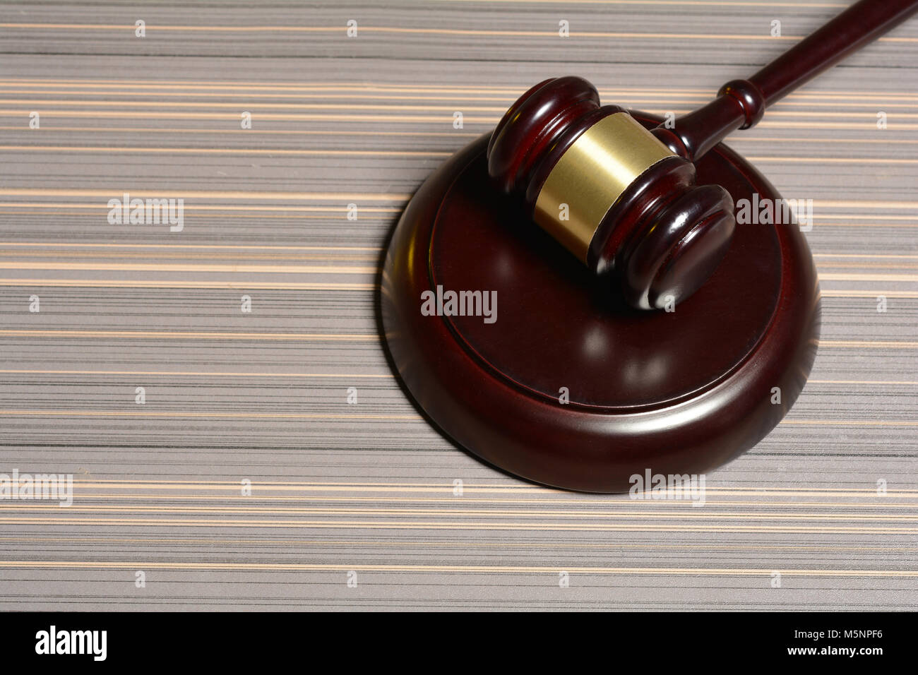 Wooden Gavel with stang on table background Stock Photo - Alamy