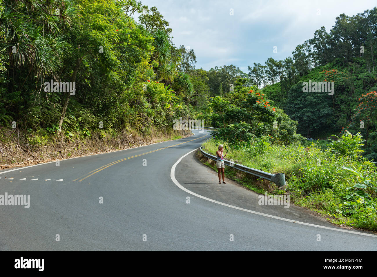 MAUI, HAWAII, USA-DECEMBER 15, 2013: Female tourist taking pictures of ...