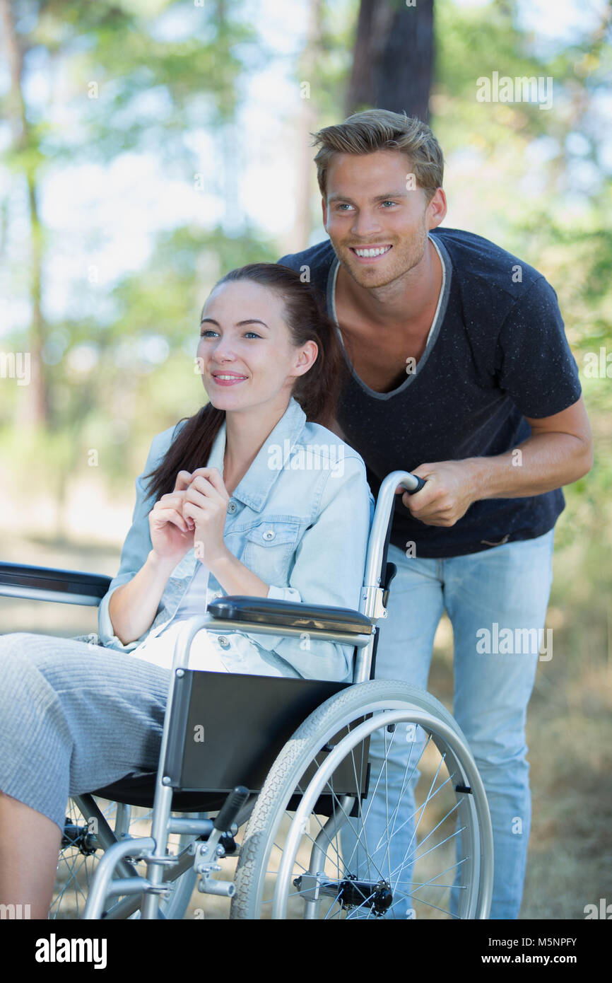 peaceful young couple in wheelchairs in park Stock Photo - Alamy