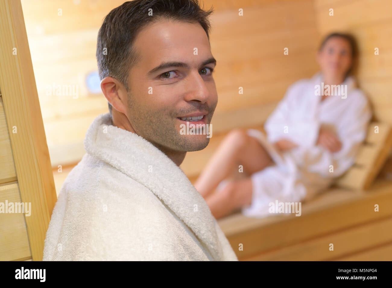 young relaxed couple enjoying time in sauna Stock Photo - Alamy