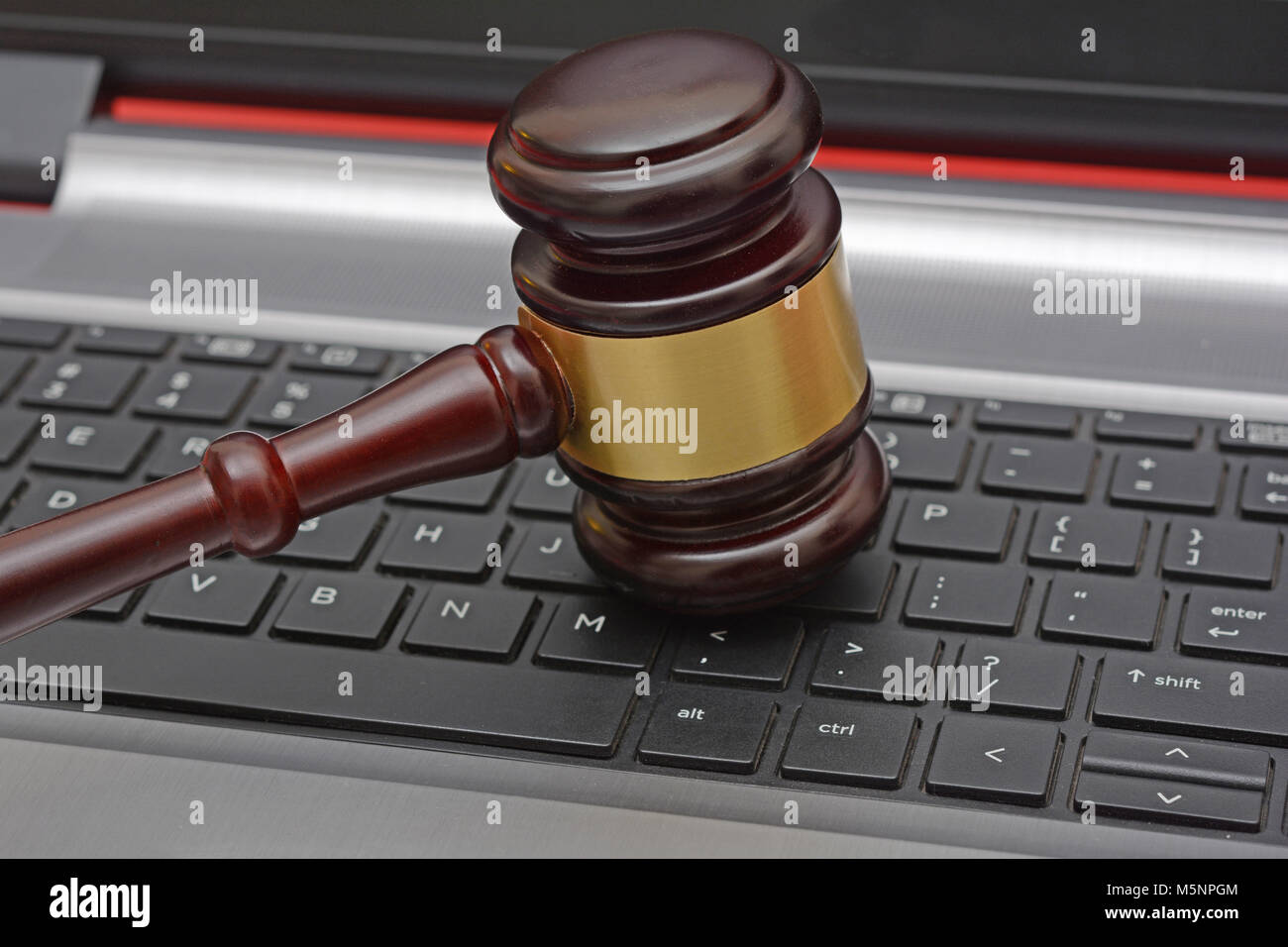 Online Auction wooden Gavel on computer keyboard Stock Photo - Alamy