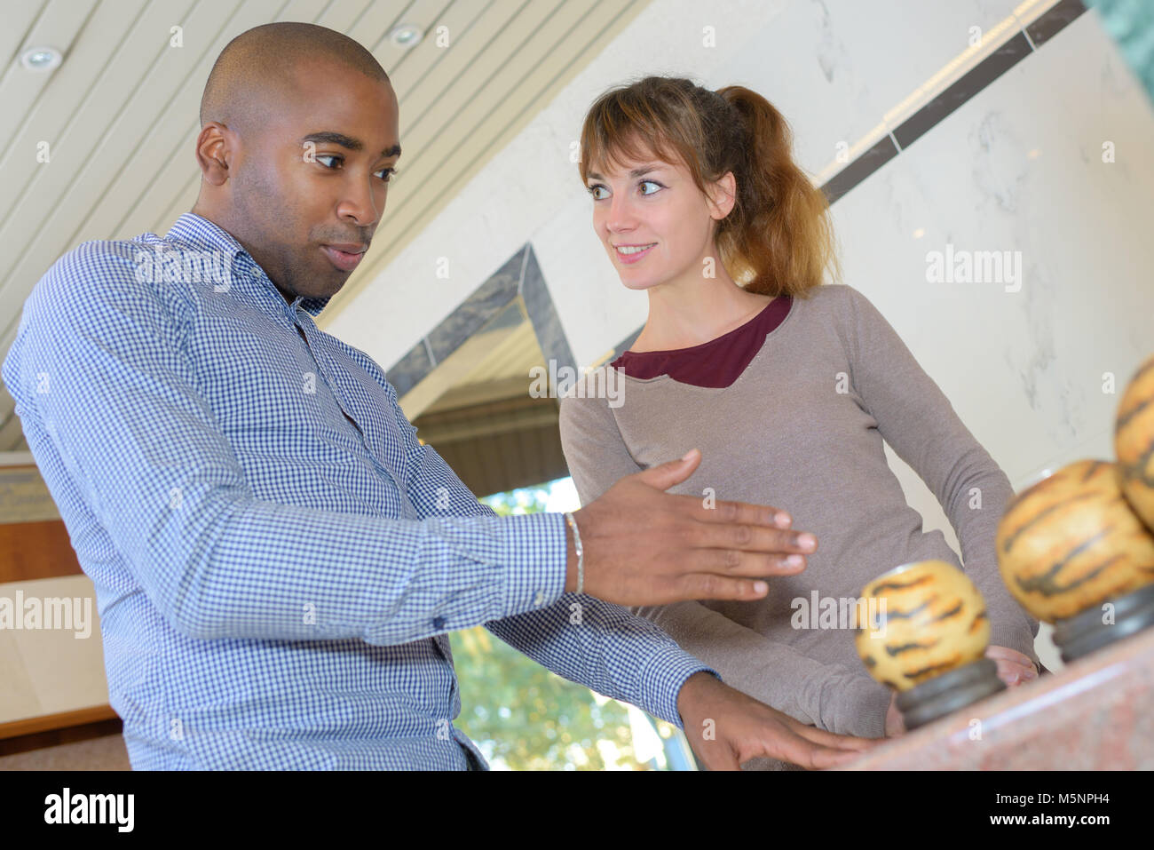 Salesman with customer Stock Photo - Alamy