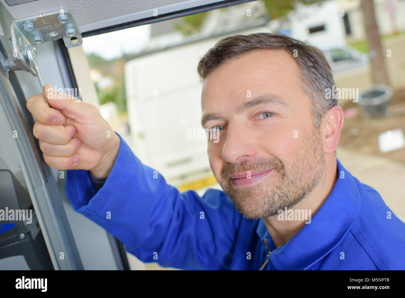 portrait of mechanic using spanner Stock Photo - Alamy