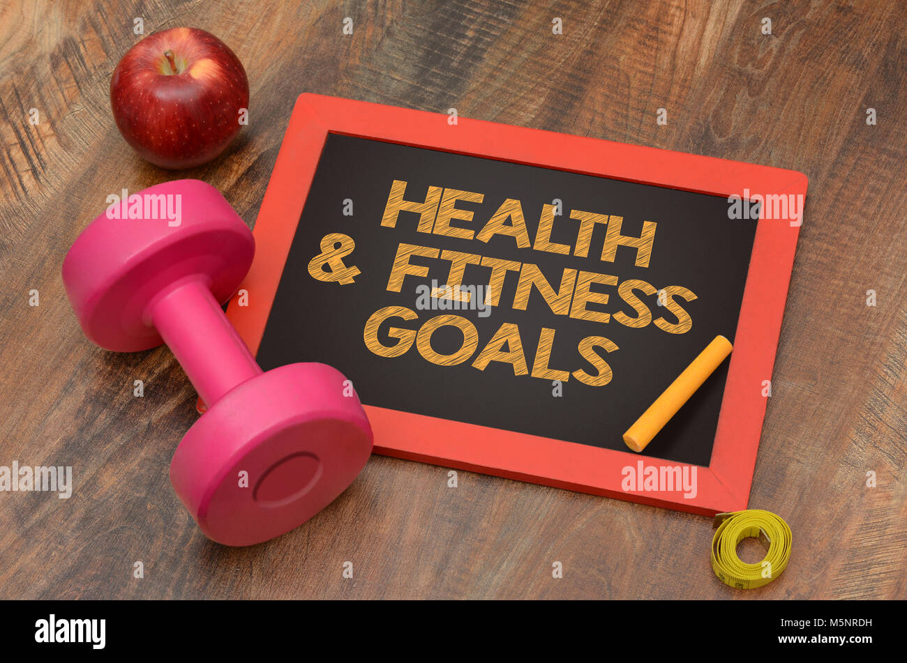 Health and Fitness goals chalkboard with dumbbell apple Stock Photo - Alamy