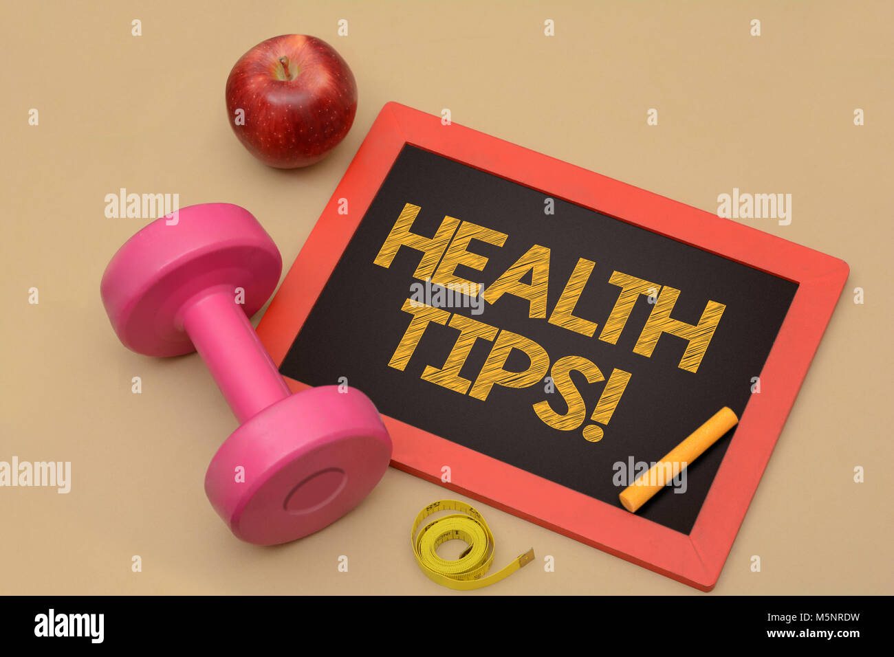 Healthy Tips sign chalkboard with dumbbell and apple Stock Photo - Alamy