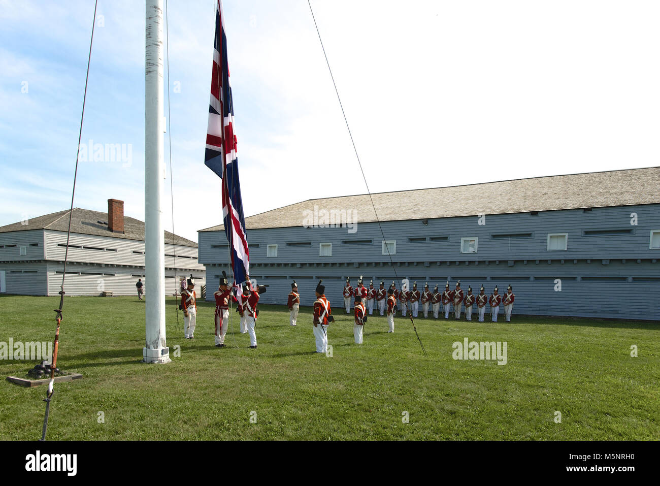 Soldiers performing the traditional lowering of the Union Jack at the ...