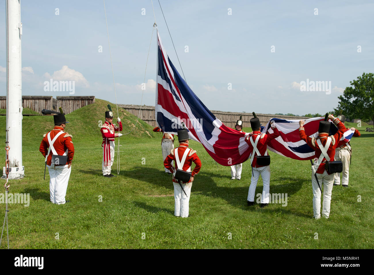 Soldiers performing the traditional lowering of the Union Jack at the ...