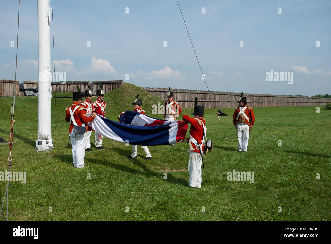 Soldiers performing the traditional lowering of the Union Jack at the ...