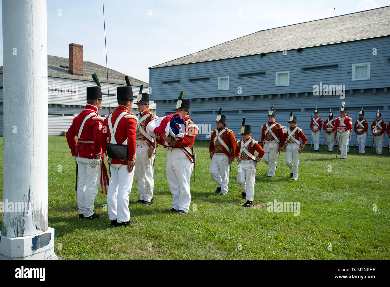 Soldiers performing the traditional lowering of the Union Jack at the ...