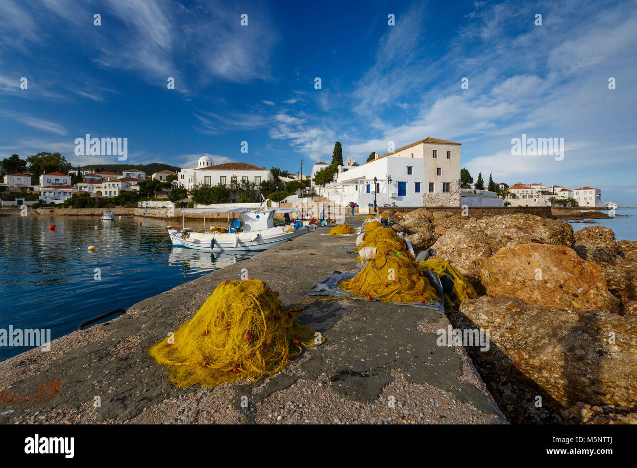 View of the Spetses seafront from the harbor pier, Greece Stock Photo ...