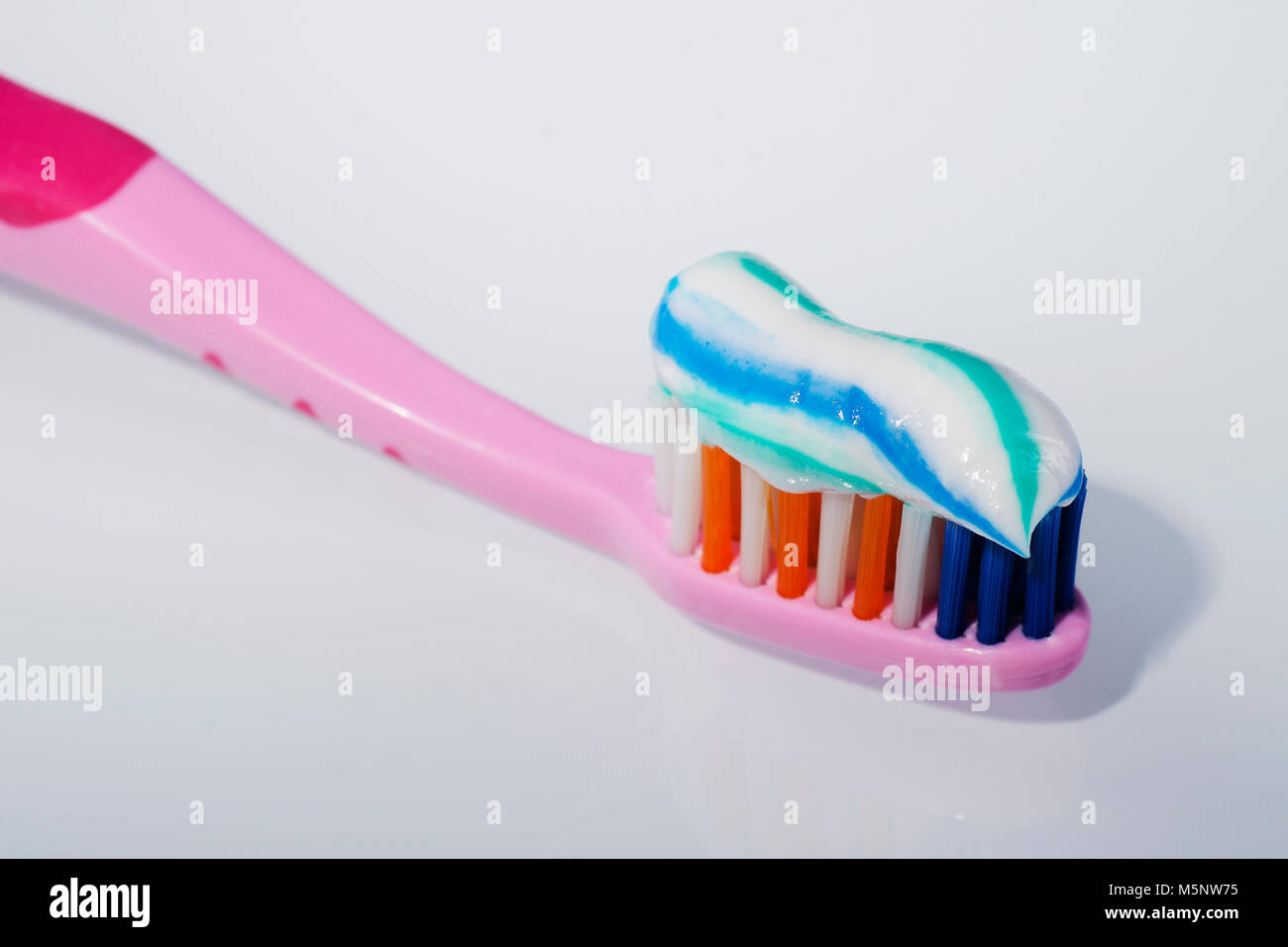 toothpaste on toothbrush isolated on white background Stock Photo - Alamy