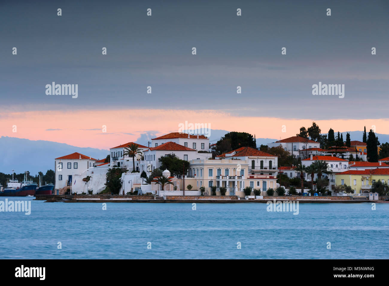 Evening view of Spetses village from the harbour pier, Greece Stock ...