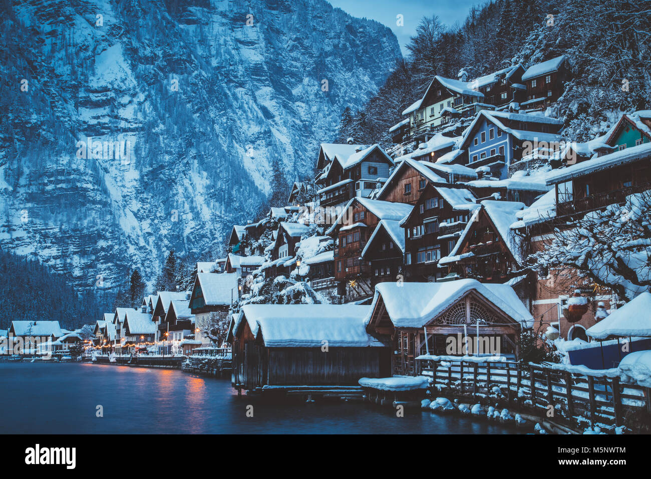 Classic postcard view of traditional wooden houses in famous Hallstatt lakeside town in the Alps ...