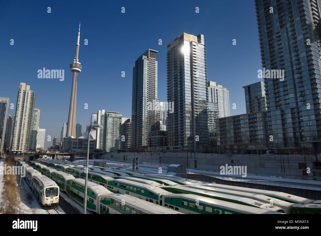 GO trains on railway tracks in downtown Toronto waiting for rush hour ...