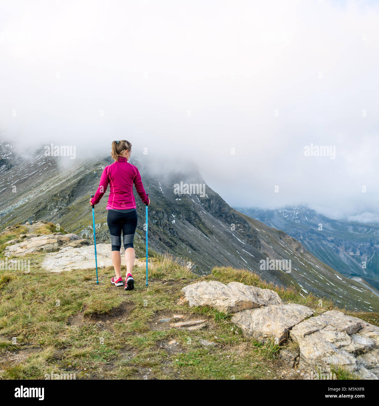 Young woman without backpack hiking in the mountains. Alps. Austria ...