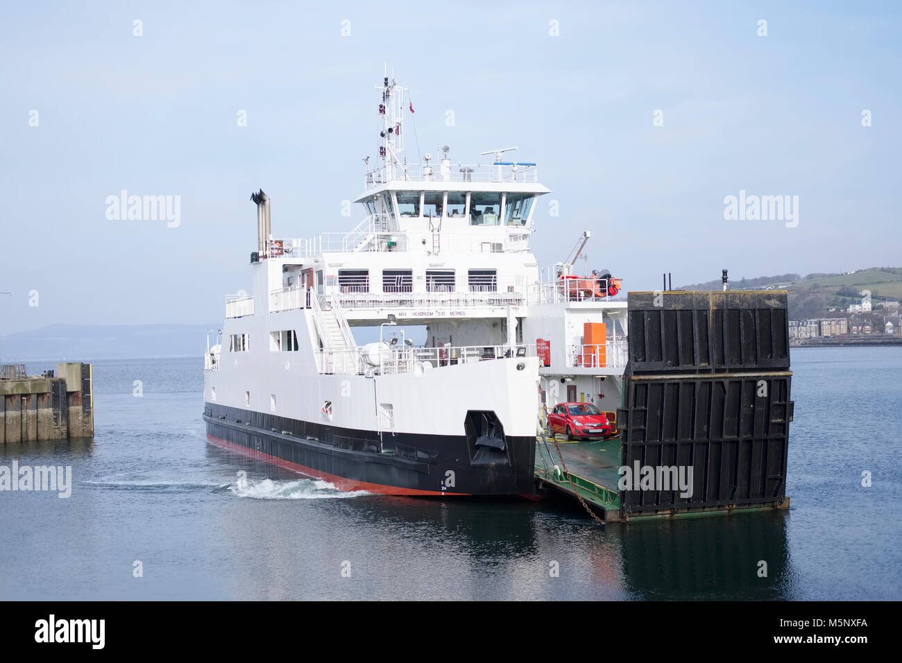 Ferry arriving at port dock lowering vehicle ramp Stock Photo - Alamy