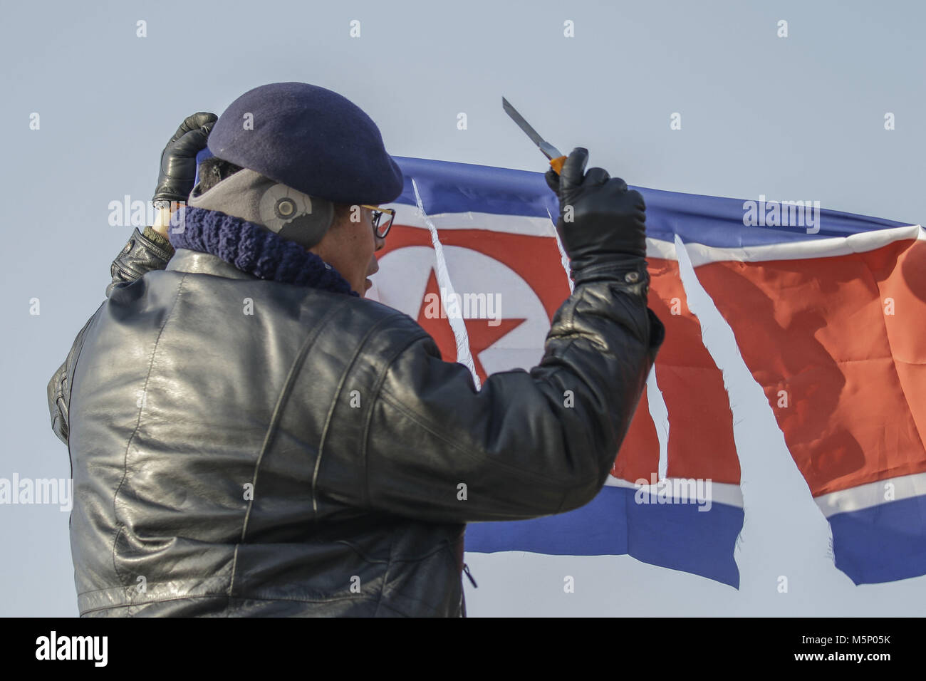 Paku, GYEONGGI, SOUTH KOREA. 25th Feb, 2018. Protester hold with tear ...