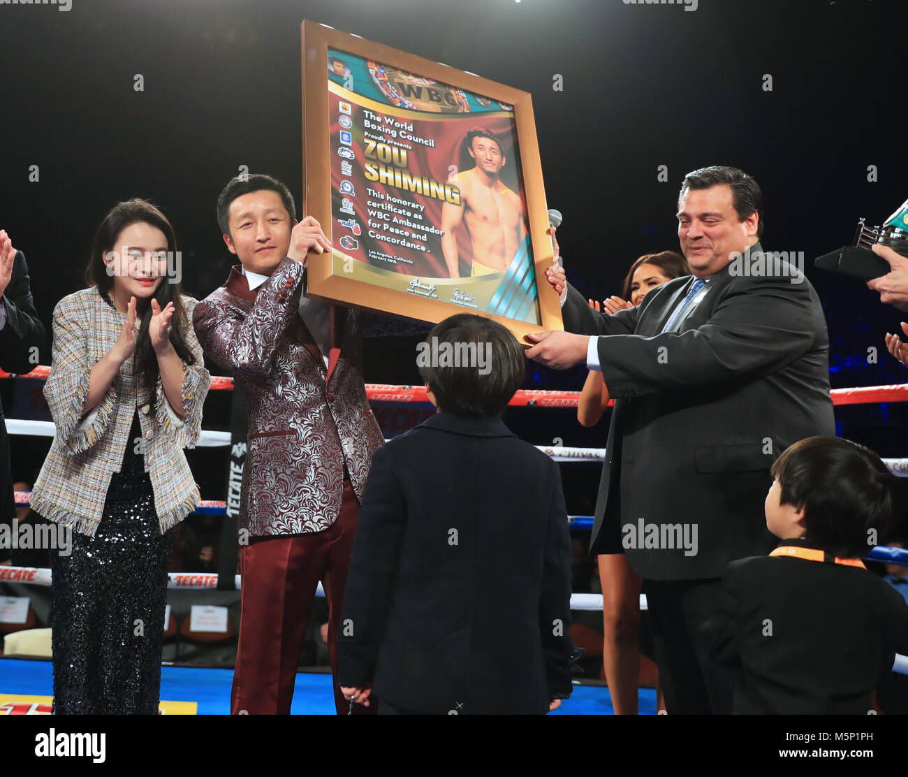 Los Angeles, USA. 24th Feb, 2018. China's boxer Zou Shiming (C ...