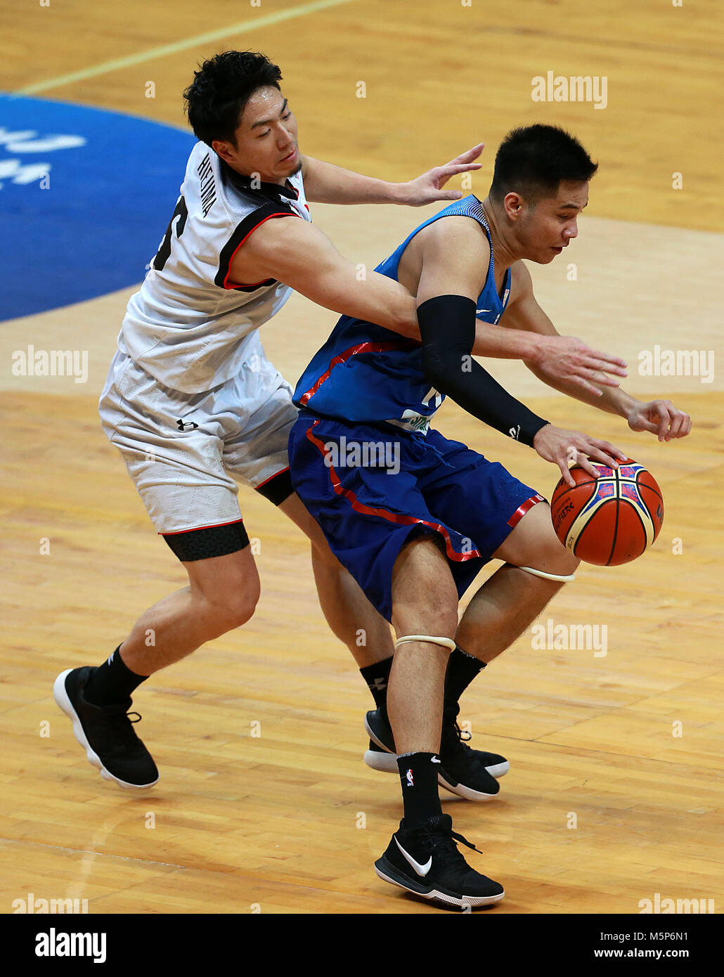 Pasay City, Philippines. 25th Feb, 2018. Roger Pogoy (R) of the ...