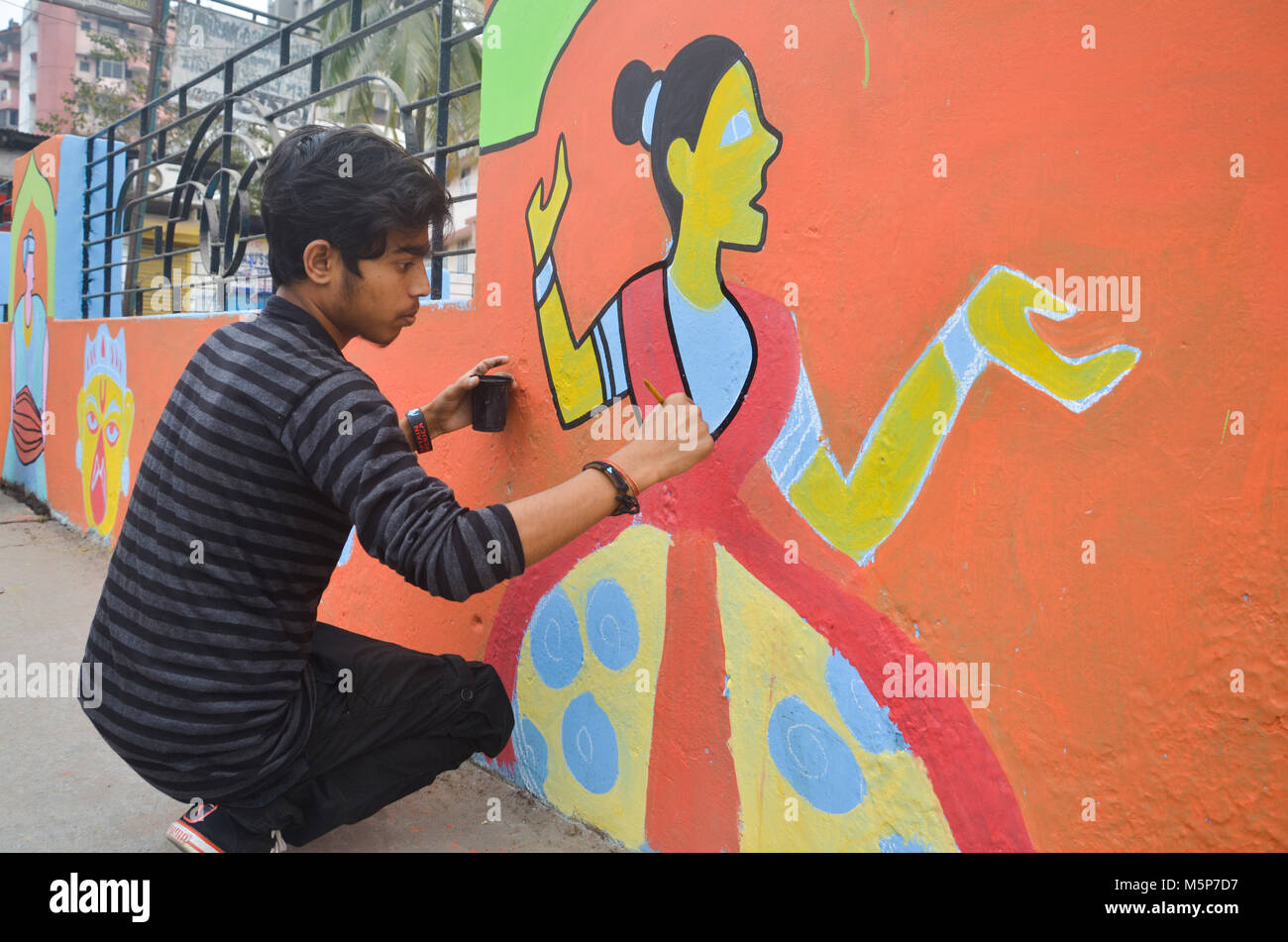 Artists painting on wall for the beautification of Guwahati city under ...