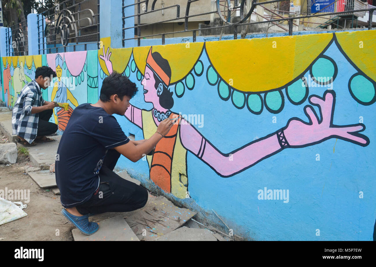 Artists painting on wall for the beautification of Guwahati city under ...