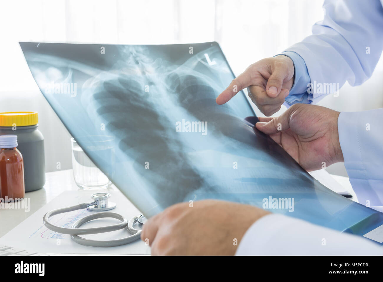 The doctor diagnosed the cause of the illness Stock Photo - Alamy