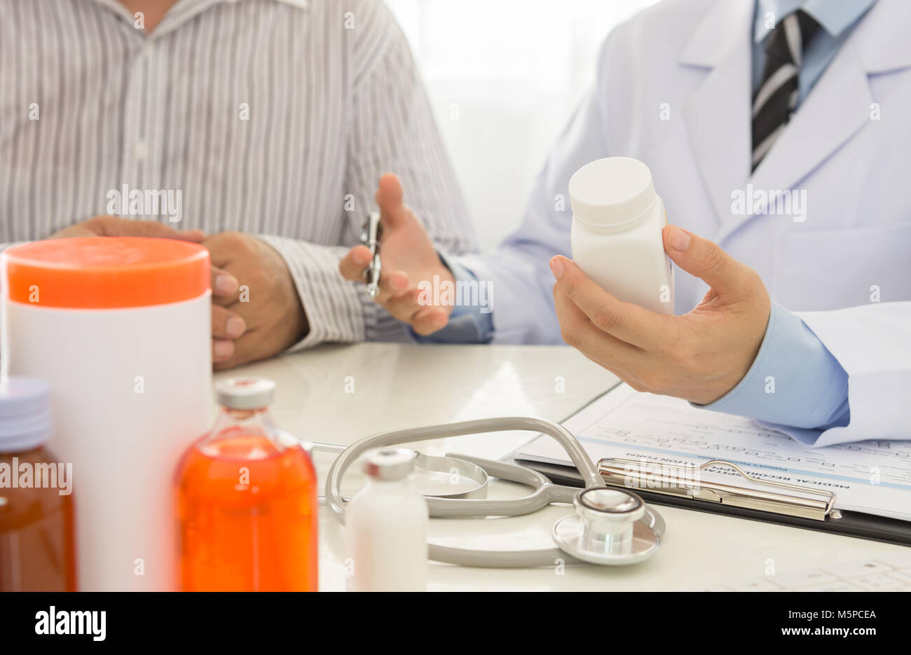 doctor prescribing medication and instructive to patient. medical ...