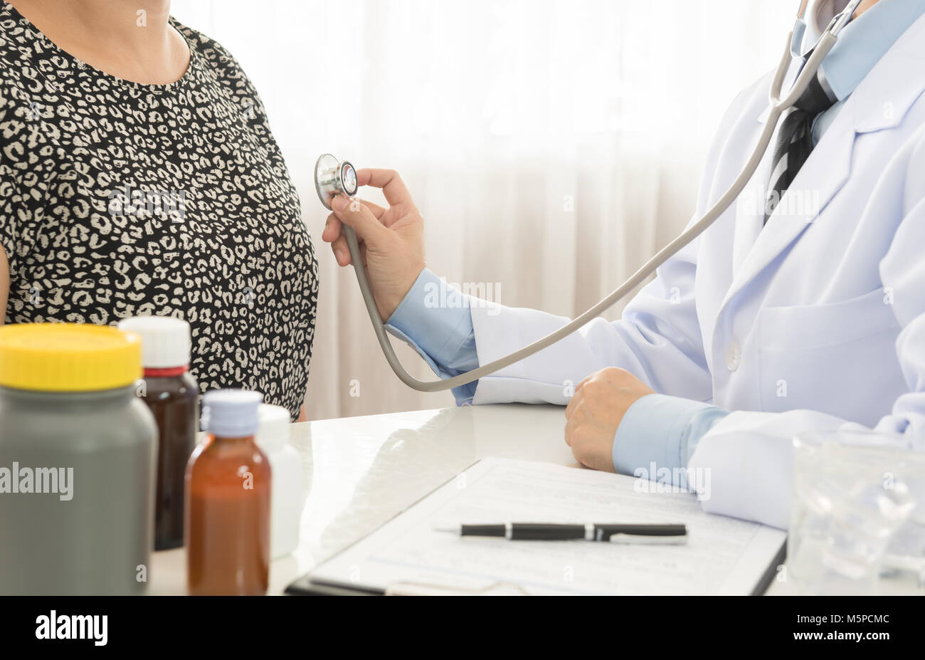 women being examined by doctor in clini Stock Photo - Alamy