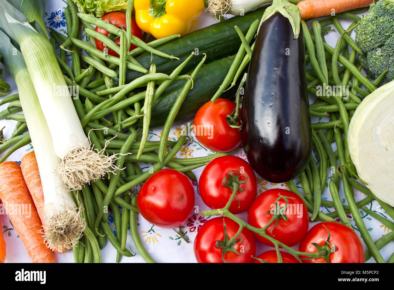 Vegetables on a table on with background Stock Photo - Alamy