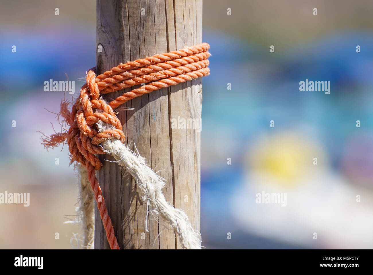 Fragment of nautical rope fence with weathered wooden Stock Photo - Alamy