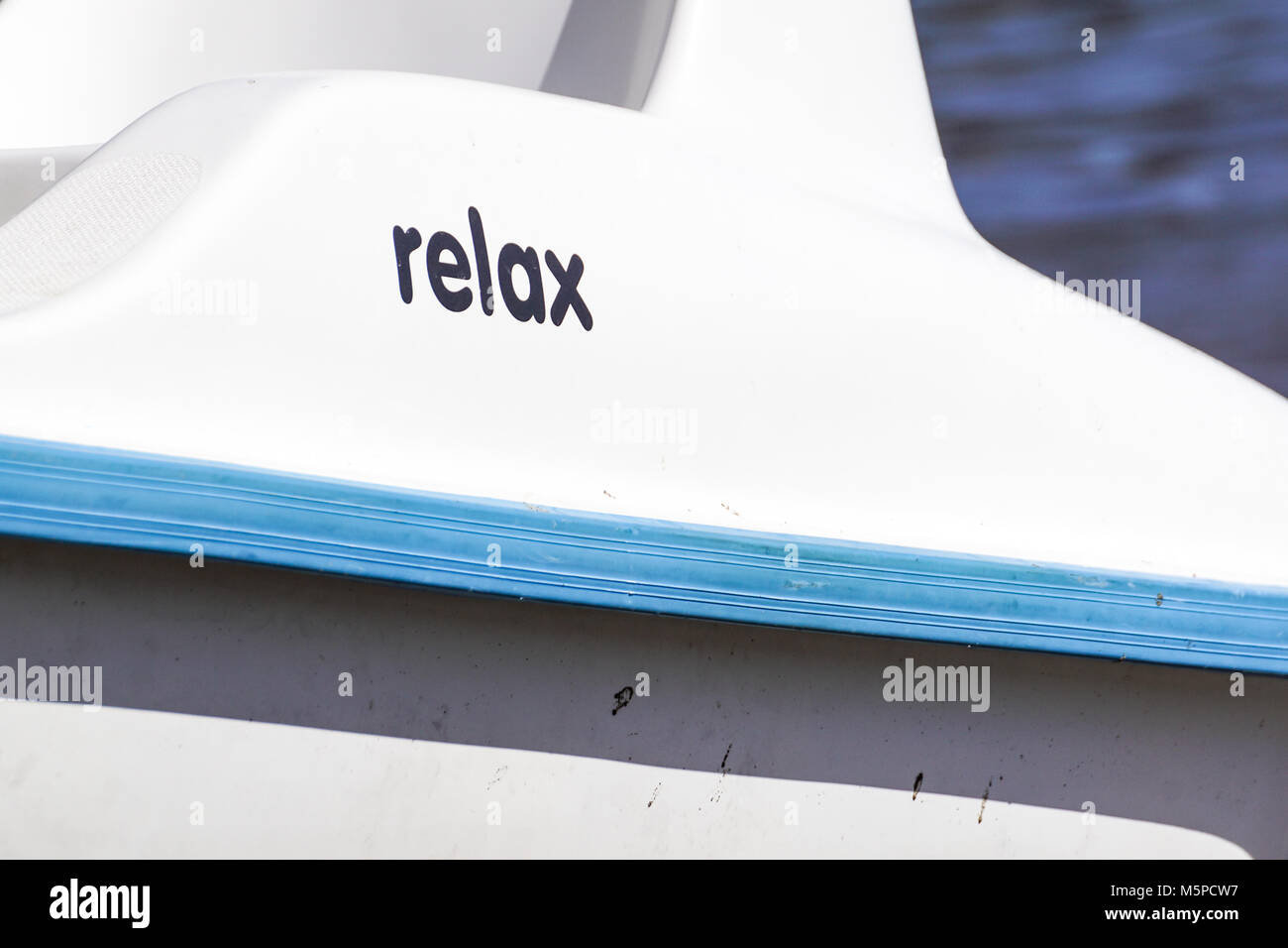 the word Relax written on board on boat in the sea on the beach Stock ...
