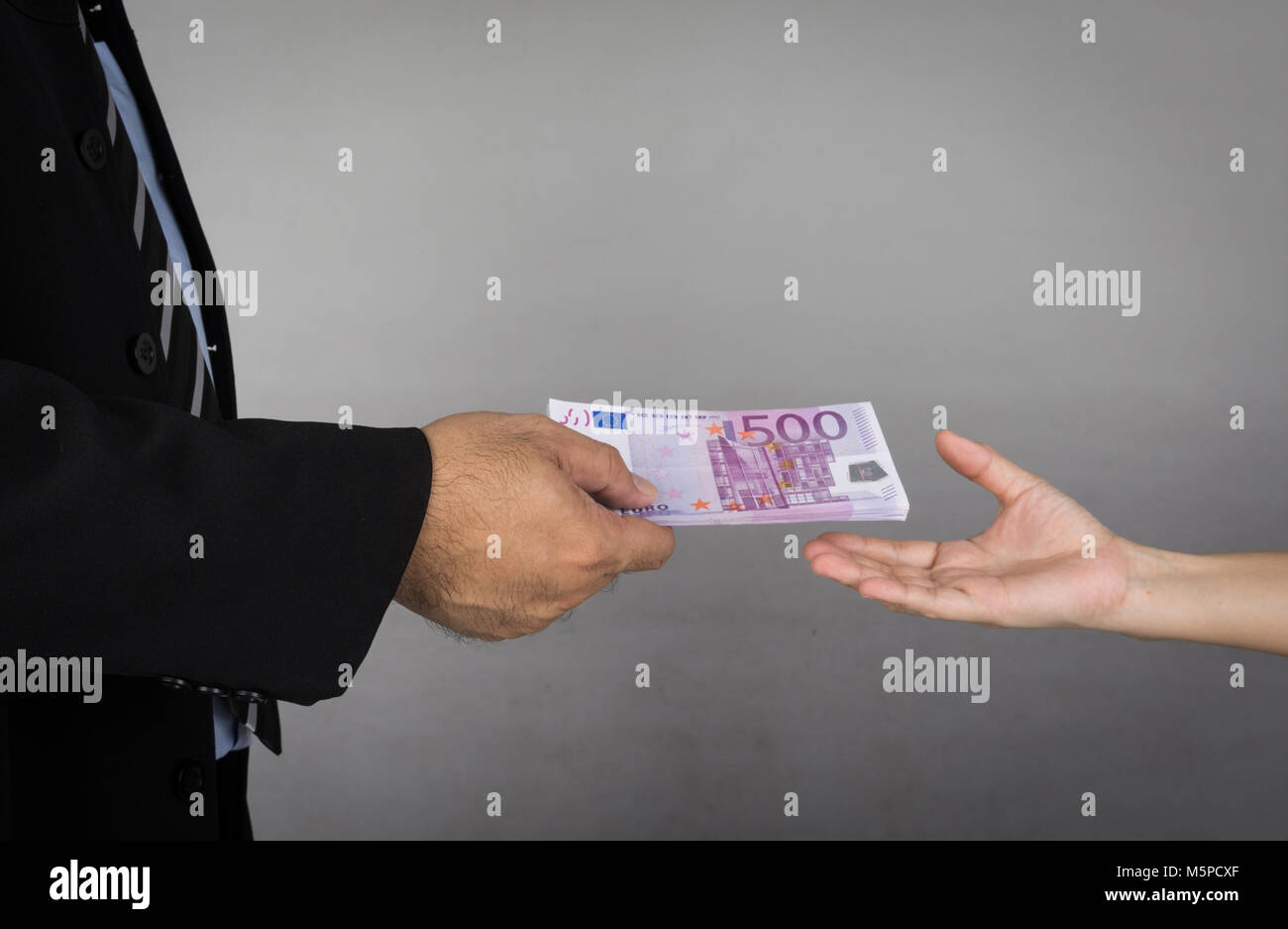 business man gives money to human Stock Photo - Alamy