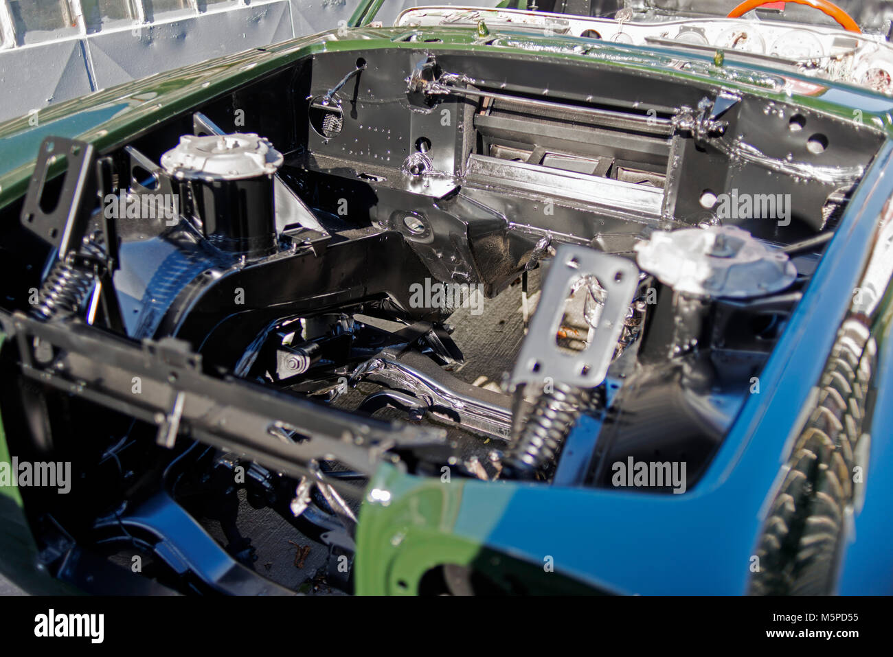 An engine of a Rolls Royce car in a car repair shop for restoration ...