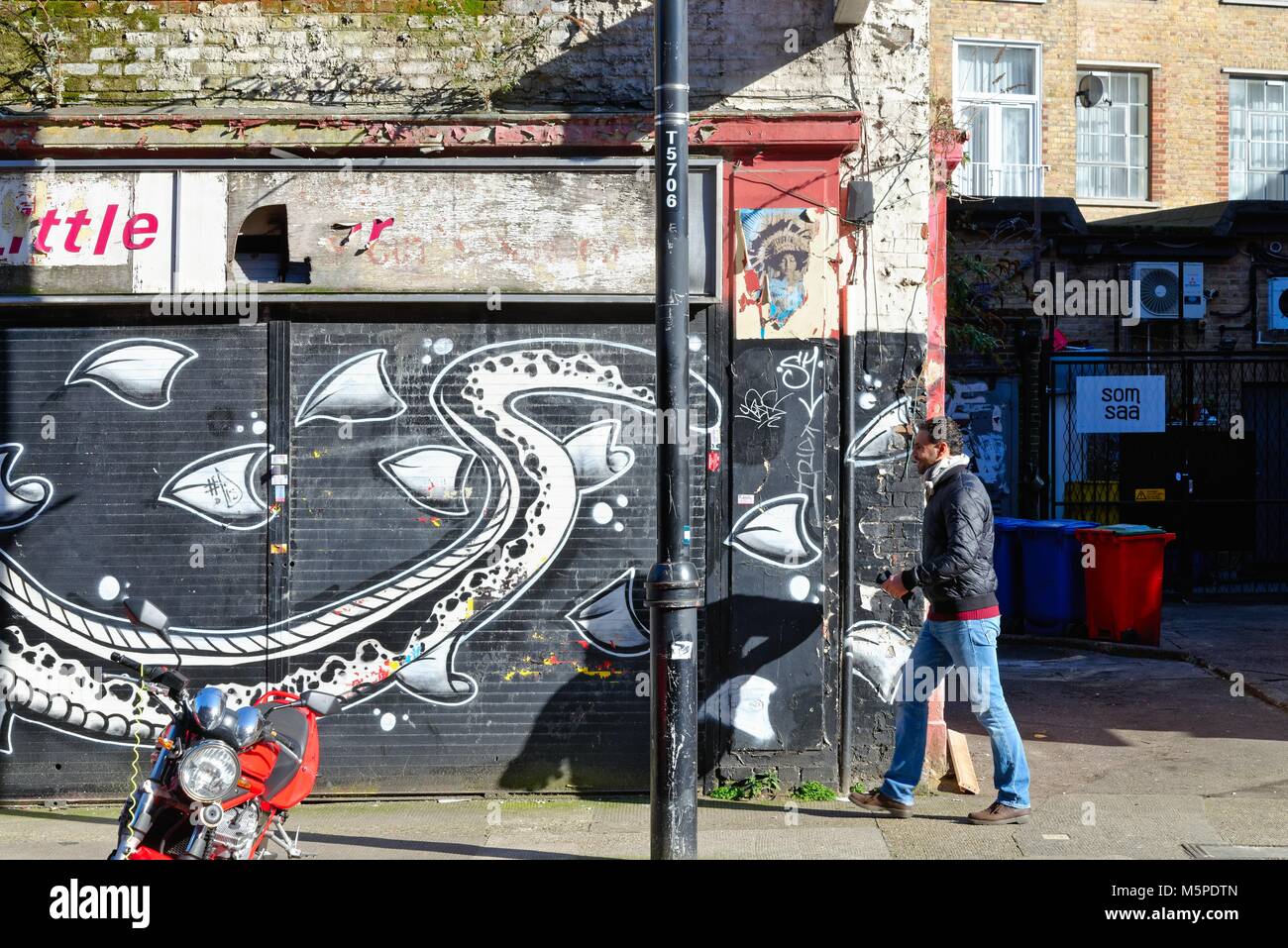 Shuttered shops with graffiti in Toynbee street Whitechapel London ...