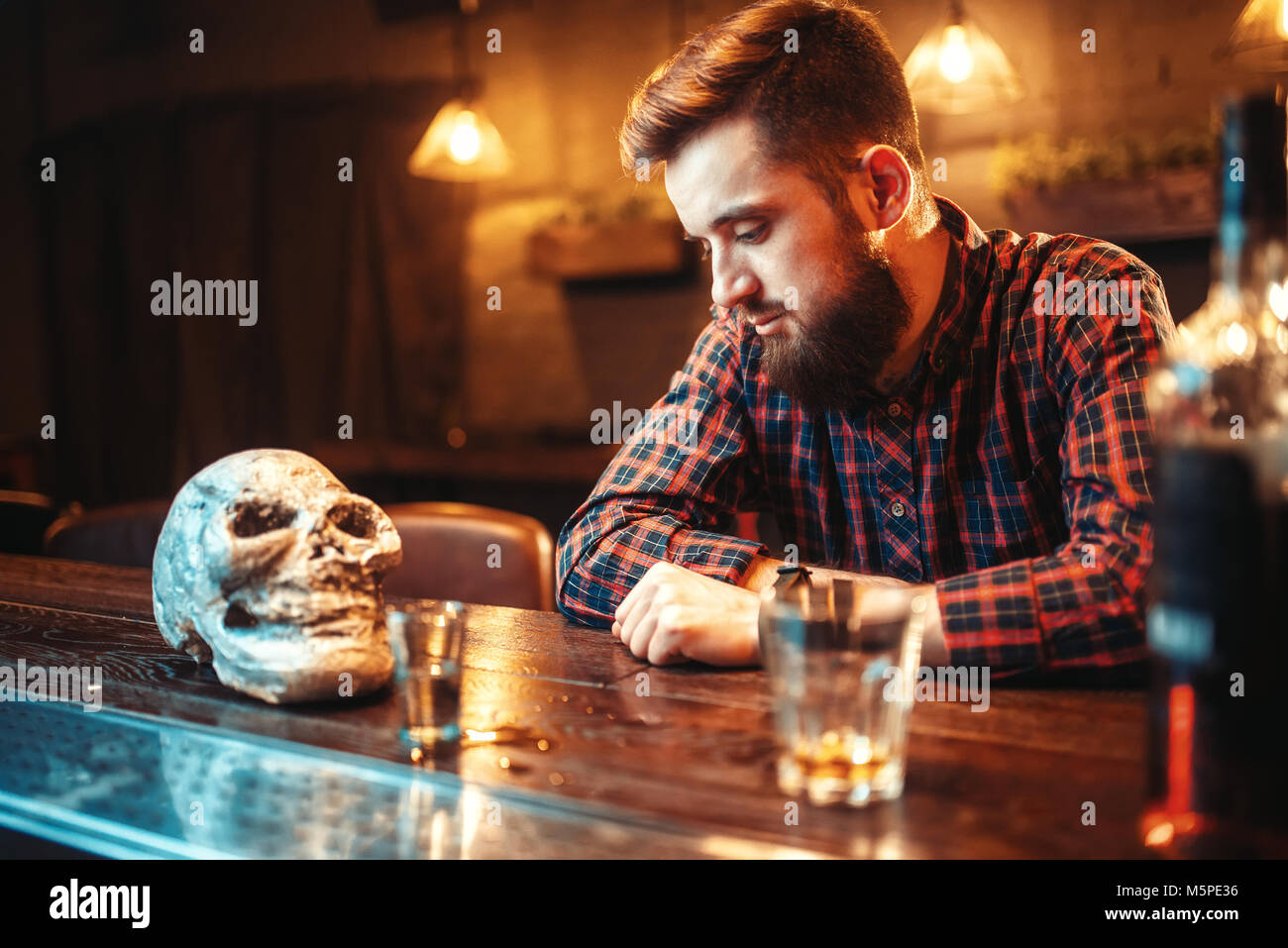 Sad man sitting at the bar counter, alcohol addiction, depression. Male ...