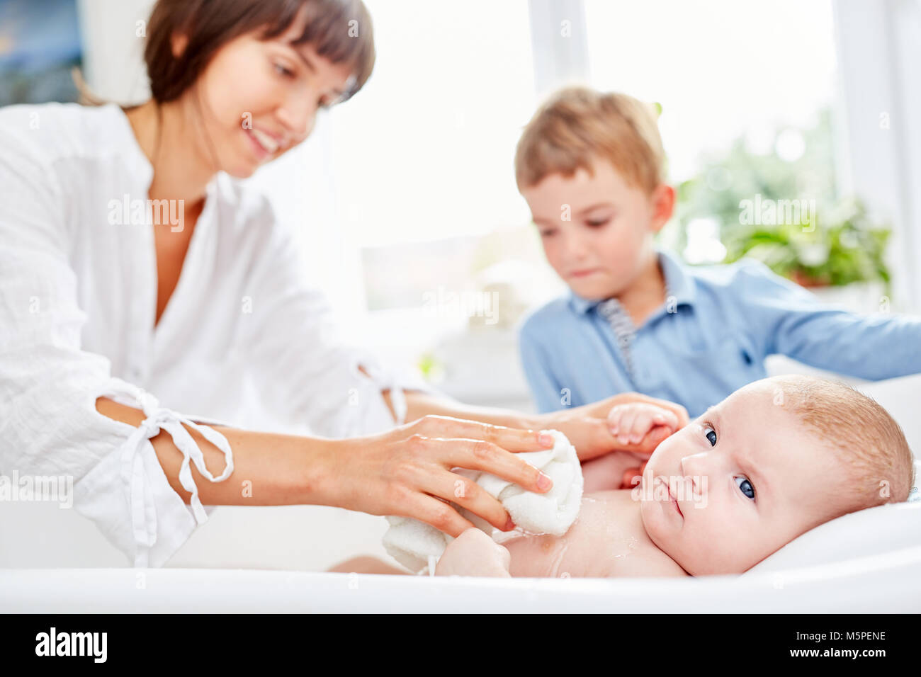 Infant washing hi-res stock photography and images - Alamy