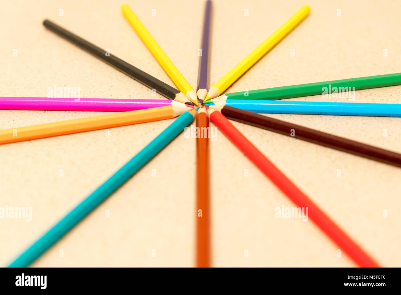 Ring of pencils isolated on a light background. Multicolored pencils ...