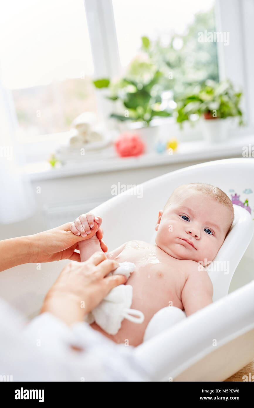 Infant bathing hi-res stock photography and images - Alamy
