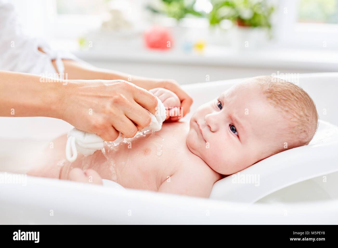 Newborn in bath hi-res stock photography and images - Alamy