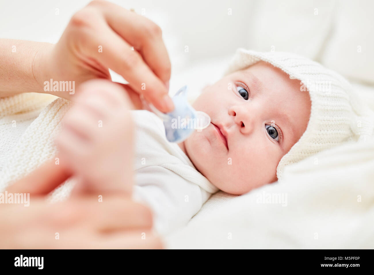 Newborn with pacifier hi-res stock photography and images - Alamy