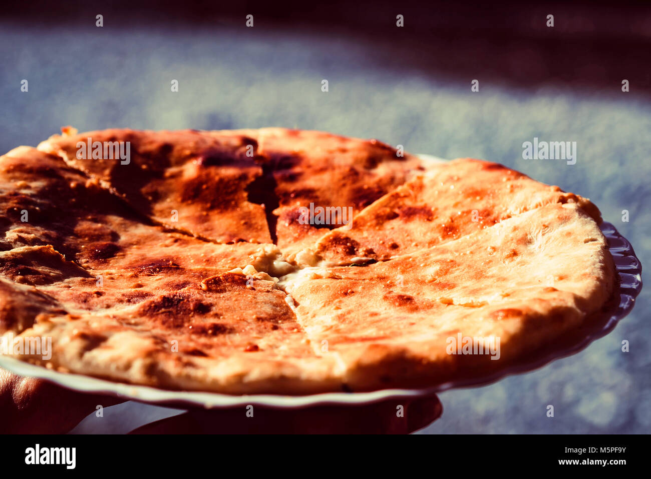 Caucasian khychin bread pie with meat close Stock Photo - Alamy