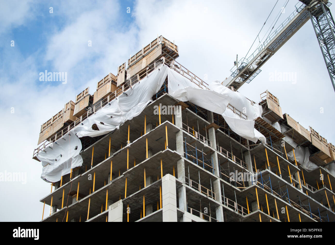 Construction of the modern condo buildings with huge windows and ...