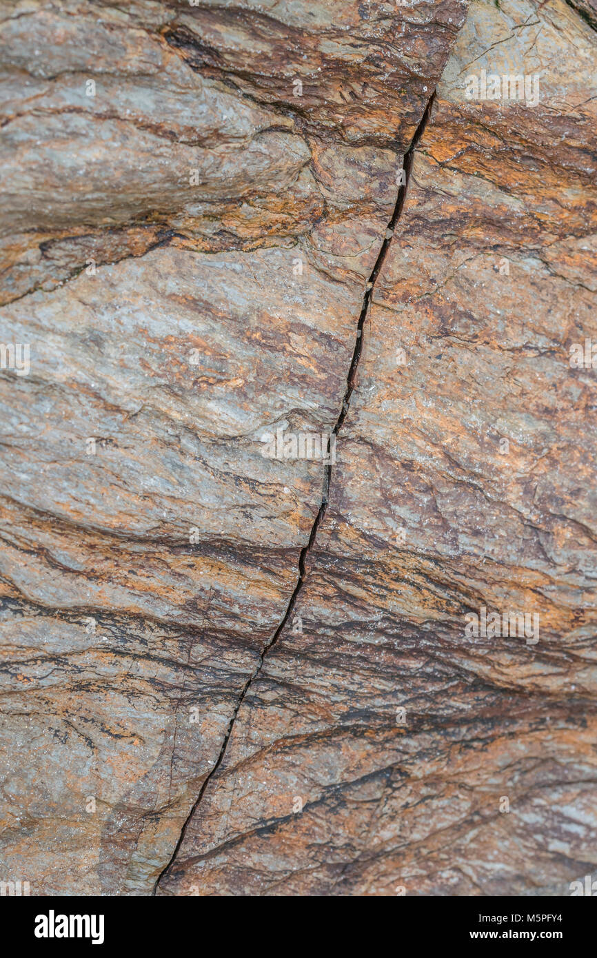 Fissure or crack in a rock formation in Cornwall. Concept ...