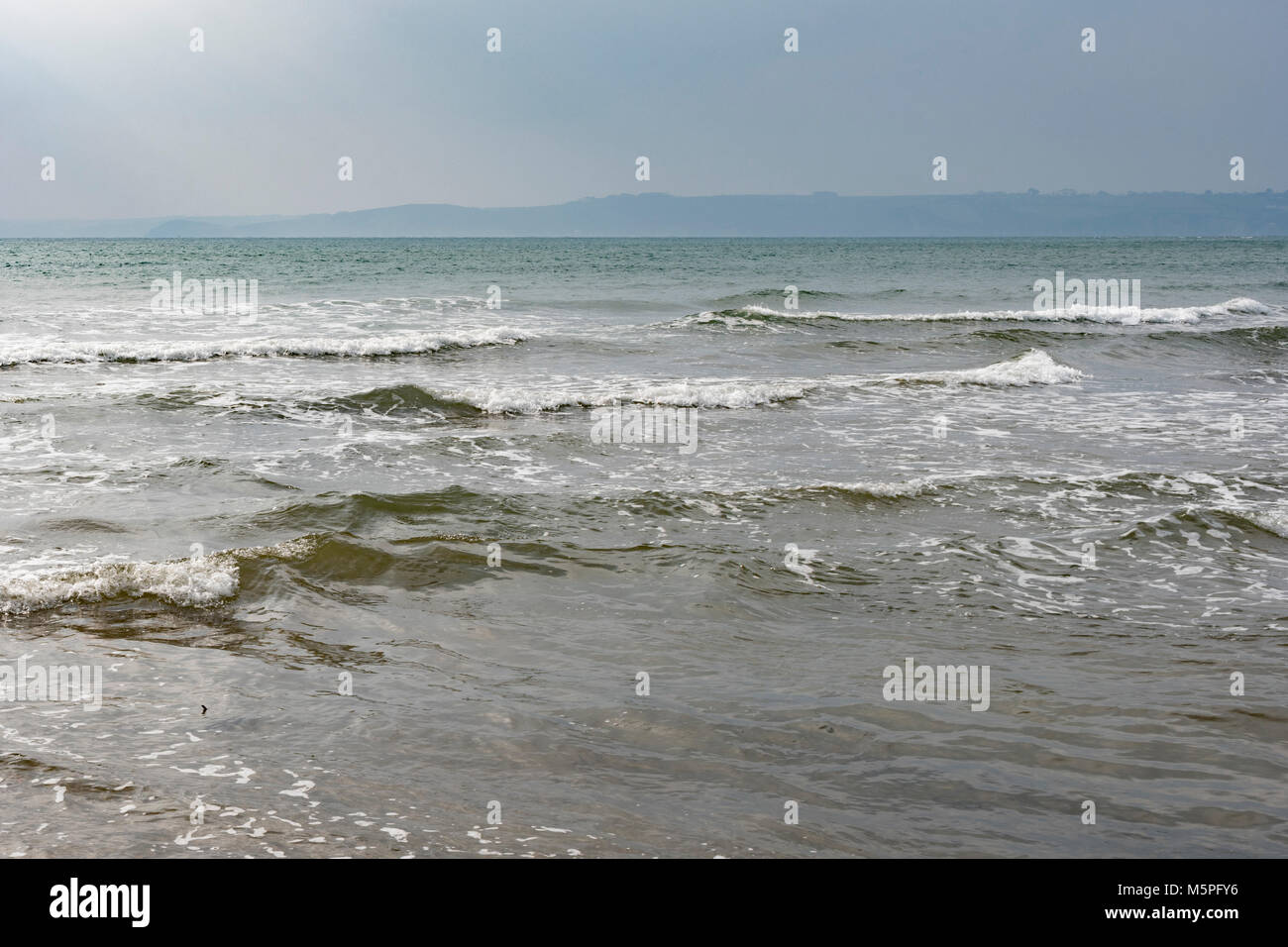 Receding tide on a Cornwall beach Stock Photo - Alamy
