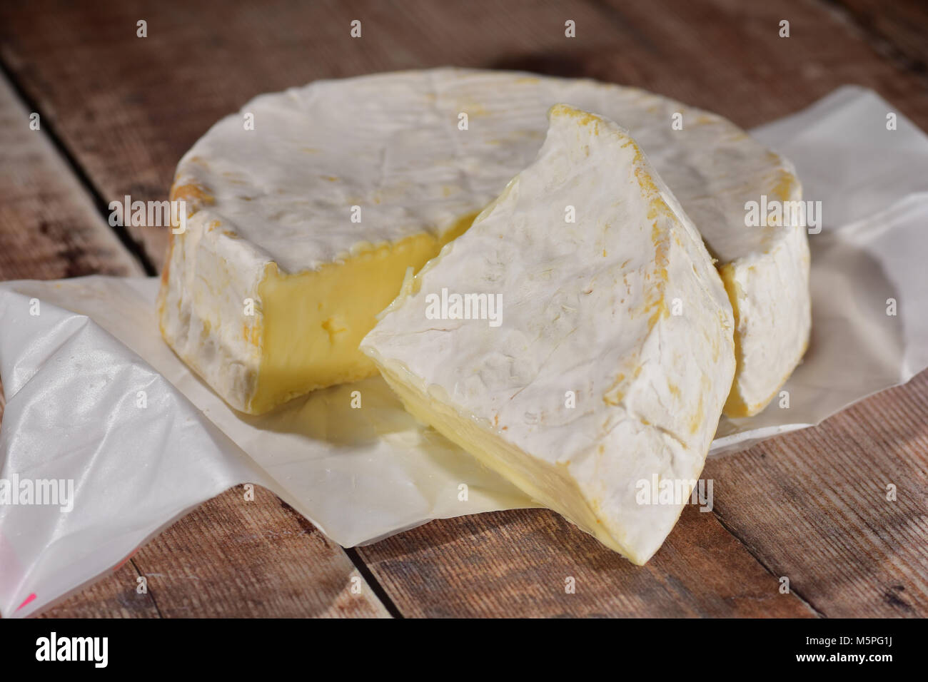 Goats Cheese fresh with the wrapper Stock Photo - Alamy