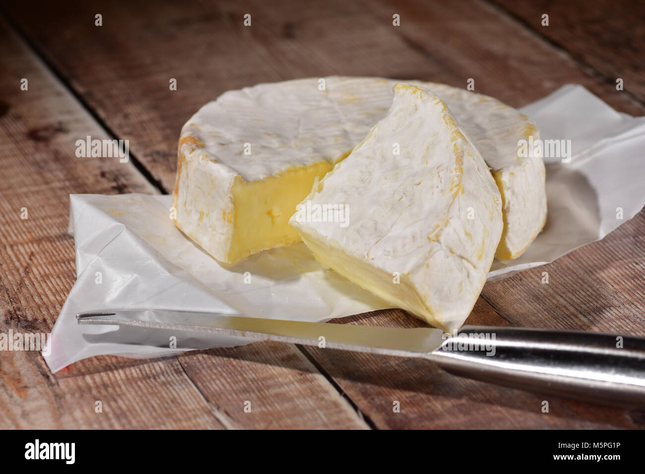 Goats Cheese fresh with the wrapper Stock Photo - Alamy