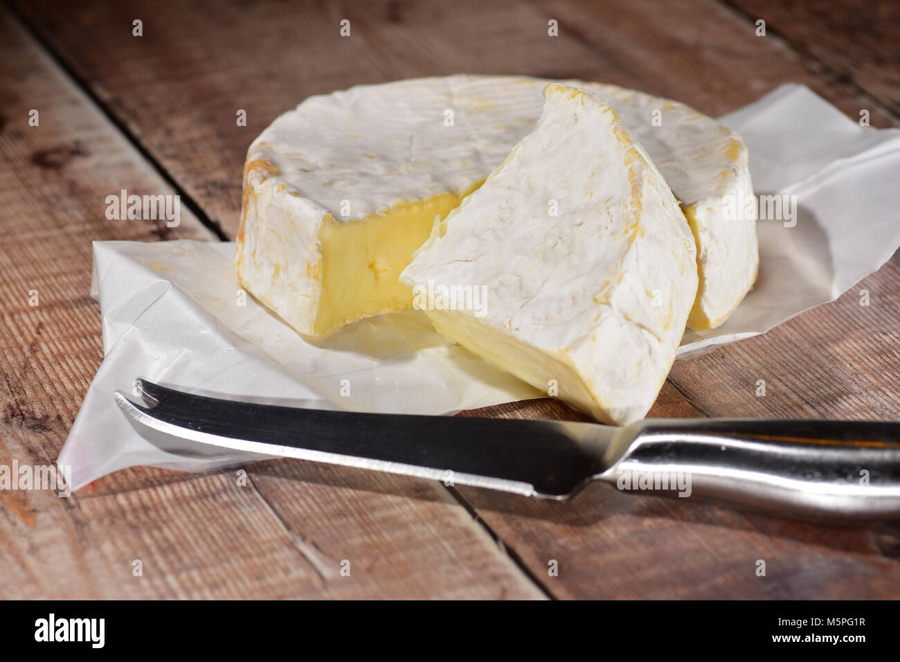 Goats Cheese fresh with the wrapper Stock Photo - Alamy