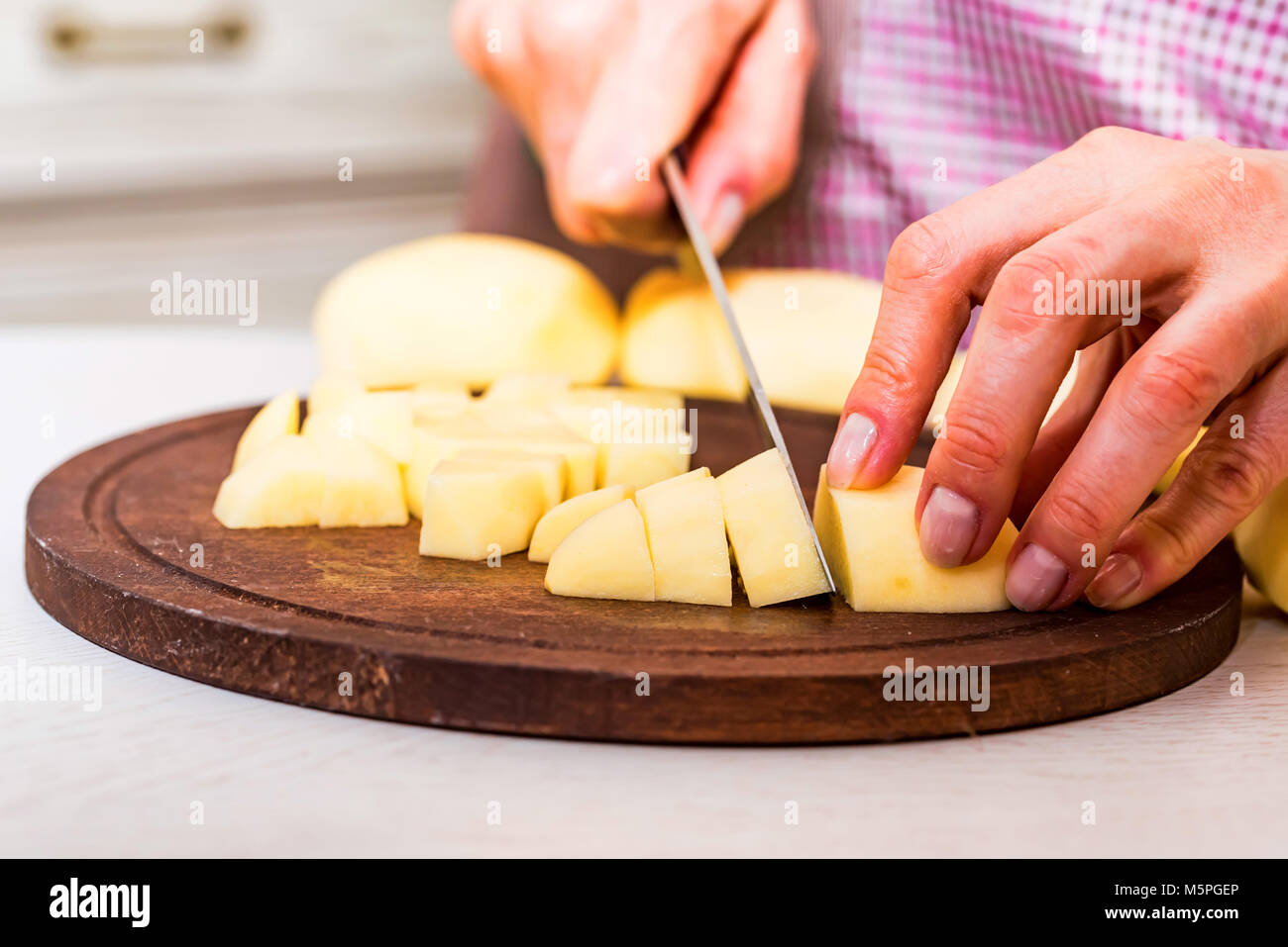 Cut potatoes on board knife hi-res stock photography and images - Alamy